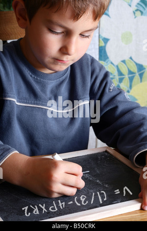 Young mathematician working on a blackboard Stock Photo - Alamy