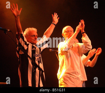 Billy Mitchell of the pop group Lindisfarne with pictures of members of ...