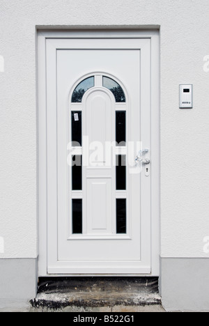 Front door of newly built house closeup Stock Photo - Alamy
