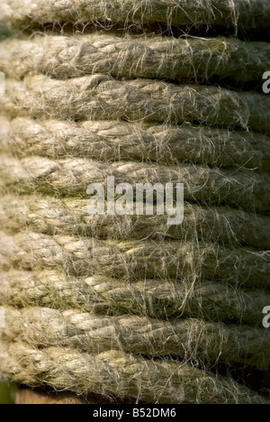 Wooden mooring post with strong rope around it Stock Photo - Alamy