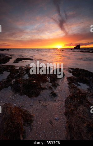 Sunset over Thurlestone rock Devon UK Stock Photo - Alamy