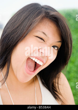Happy woman winking Stock Photo - Alamy