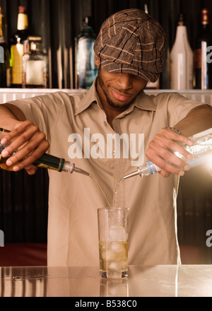 Bartender is pouring drink Stock Photo - Alamy