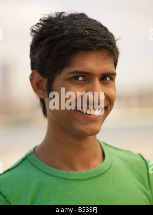 Portrait of a smiling confident Indian man at the beach Stock Photo - Alamy
