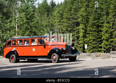 Propane powered red tour bus at Saint Mary Lake in Glacier National ...