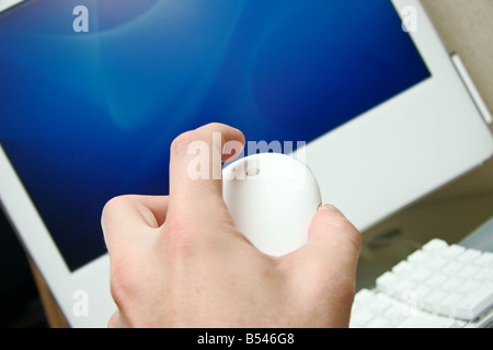 Hand with computer mouse over a white background Stock Photo - Alamy