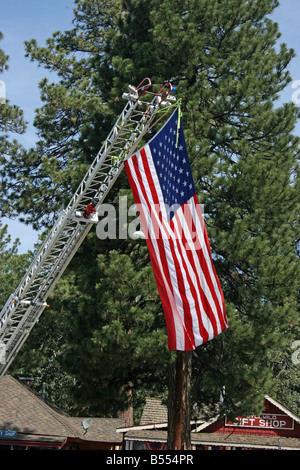 An American flag hangs from the ladder of a 90th Civil Engineer ...