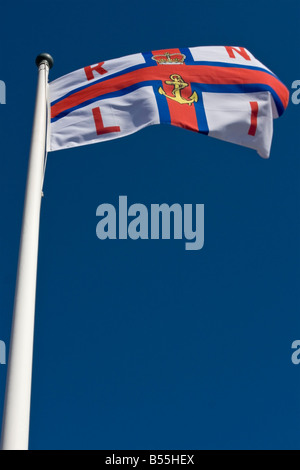RNLI flag against sky Stock Photo - Alamy
