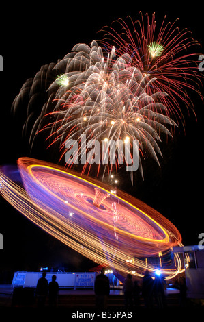 Fireworks and fairground ride Stock Photo - Alamy
