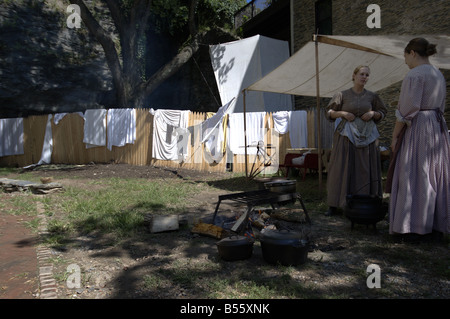 Women doing laundry for the soldiers during a re enactment of day to ...