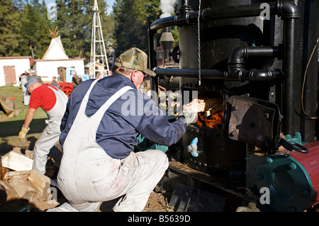 FIRE ENGINE Wood fired steam engine powering a horse drawn American ...