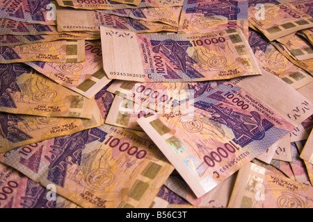 10000 West African cfa franc notes inside an open brown envelope. 3D ...