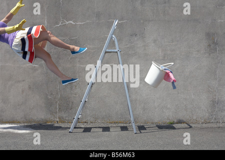 Woman falling off ladder Stock Photo - Alamy