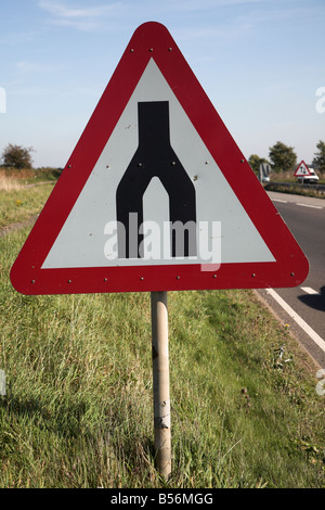 Road sign warning sign of dual carriageway ending speed reduction ...