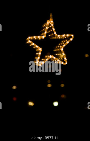 An LED star reflecting in a window Stock Photo - Alamy