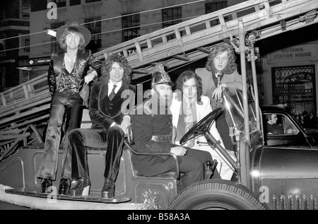 The Slade pop group on fire engine. L to R Dave Hill, Don Powell, Jimmy ...
