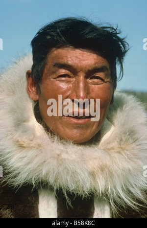 Inuit man of Boothia Peninsula. wearing a polar bearskin parka and ...