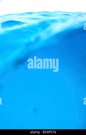 Pure water. Under the water, the rays of the sun and the sandy bottom ...