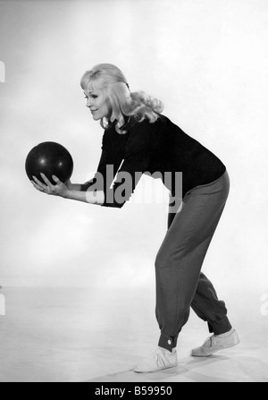 Reveille fashions: Jo Waring wearing a matching patterned slacks and ...