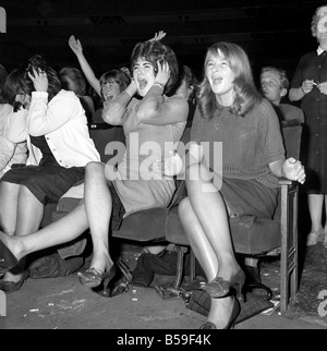 Screaming girl fans greet the Beatles last night on their appearance in ...