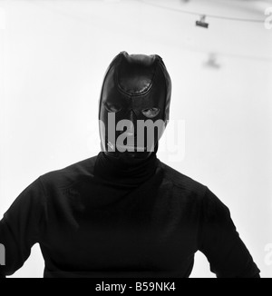 Horror: Crime: Mask: Unusual: Man wearing leather hood. May 1975 Stock ...