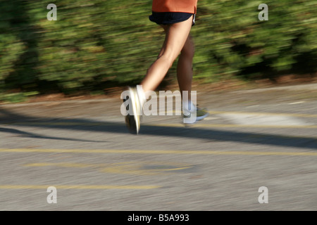 abstract feet of fast runner in park Stock Photo - Alamy