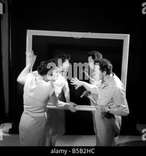 Mirror image: A couple argue in front of a mirror. 1958 Stock Photo - Alamy