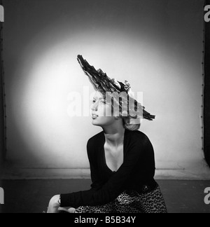 Woman modelling the latest 1956 hat fashions in the Reveille studios ...