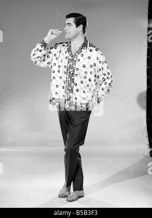 Male model Peter Christian wearing silk shirt. Circa 1964 Stock Photo ...