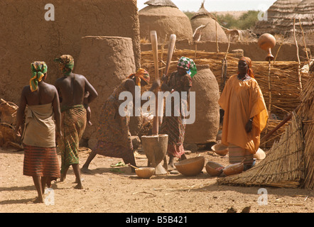 Niger, West Africa. Village Women Pounding and Sifting Millet to Make ...