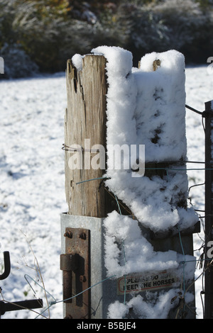 Gate post covered in snow Stock Photo - Alamy
