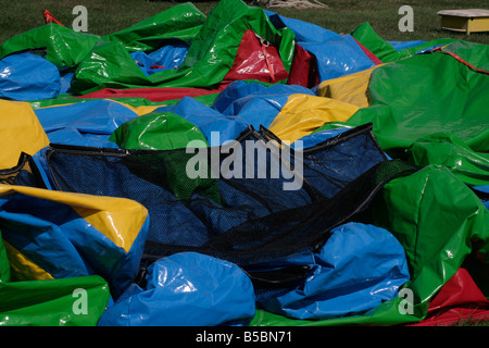 Deflated inflatable childrens bouncy castle at event Stock Photo - Alamy