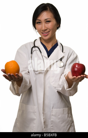 Asian woman doctor medical professional talking smartphone phone call ...