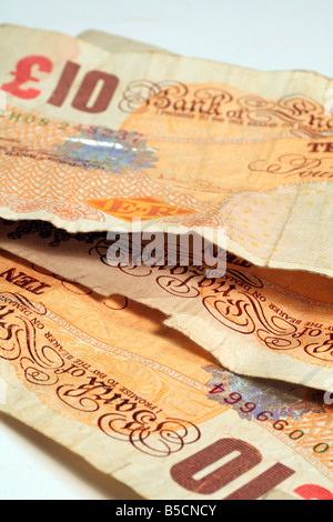 Old Ten pound notes still in circulation frayed torn and dirty at the ...