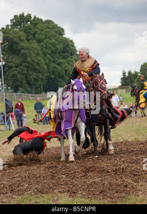 Knight falling off horse at a joust Stock Photo - Alamy