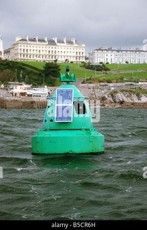 A Green Navigation Buoy with a solar Panel in the Shetland Sound on a ...