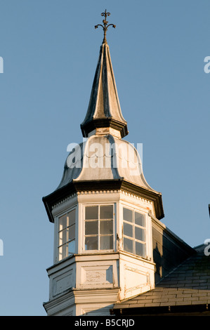 corner tower turret of Victorian building with metal girders holding it ...