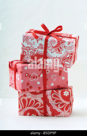 Close-up of a stack of Three wrapped gifts Stock Photo - Alamy