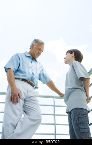 Grandfather, grandson, conversation, eye contact, page portrait, blur ...
