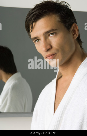 Young hispanic man wearing robe drinking coffee at home Stock Photo - Alamy