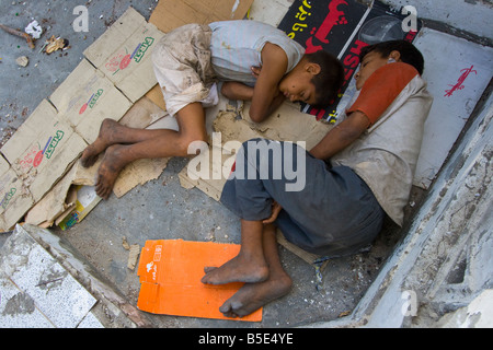 Homeless Boys Sleeping Outside in Alexandria Egypt Stock Photo - Alamy
