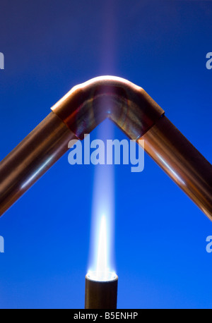 Copper elbow join heated up for soldering Stock Photo - Alamy