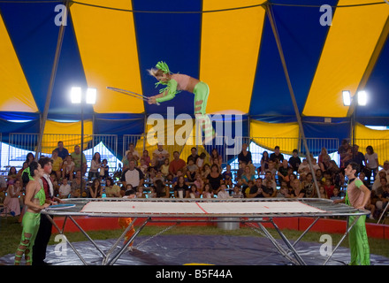 Circus performers on a trampoline Stock Photo - Alamy