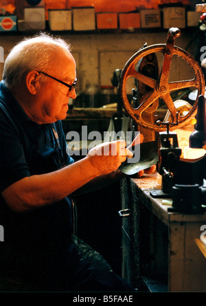 Edwin Macklow first generation cobbler at work in his shop Stock Photo ...