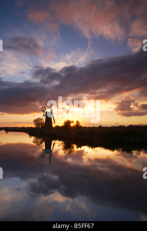 Norfolk Broads- windmill silhouetted by sunset Stock Photo - Alamy