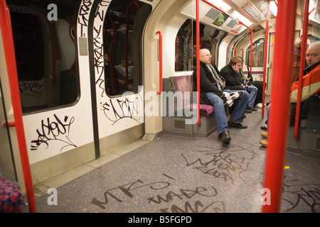 Graffiti inside a London Underground tube train carriage. Subway ...