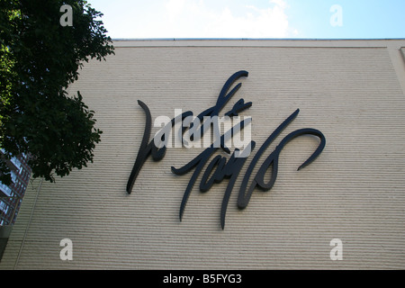 A logo sign outside of a Lord & Taylor department store location in ...