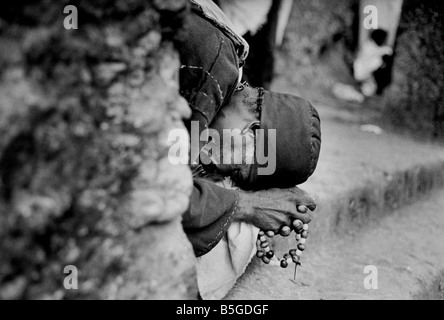 An Ethiopian Orthodox Christian pilgrim bowing in prayer at the ...