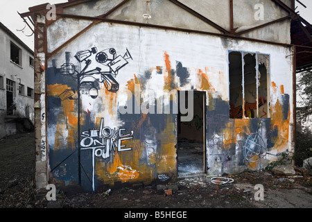 Grafiti on factory wall Stock Photo - Alamy