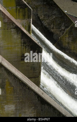 Abstract concrete wall with water overflow / drainage pipe. Blank space ...